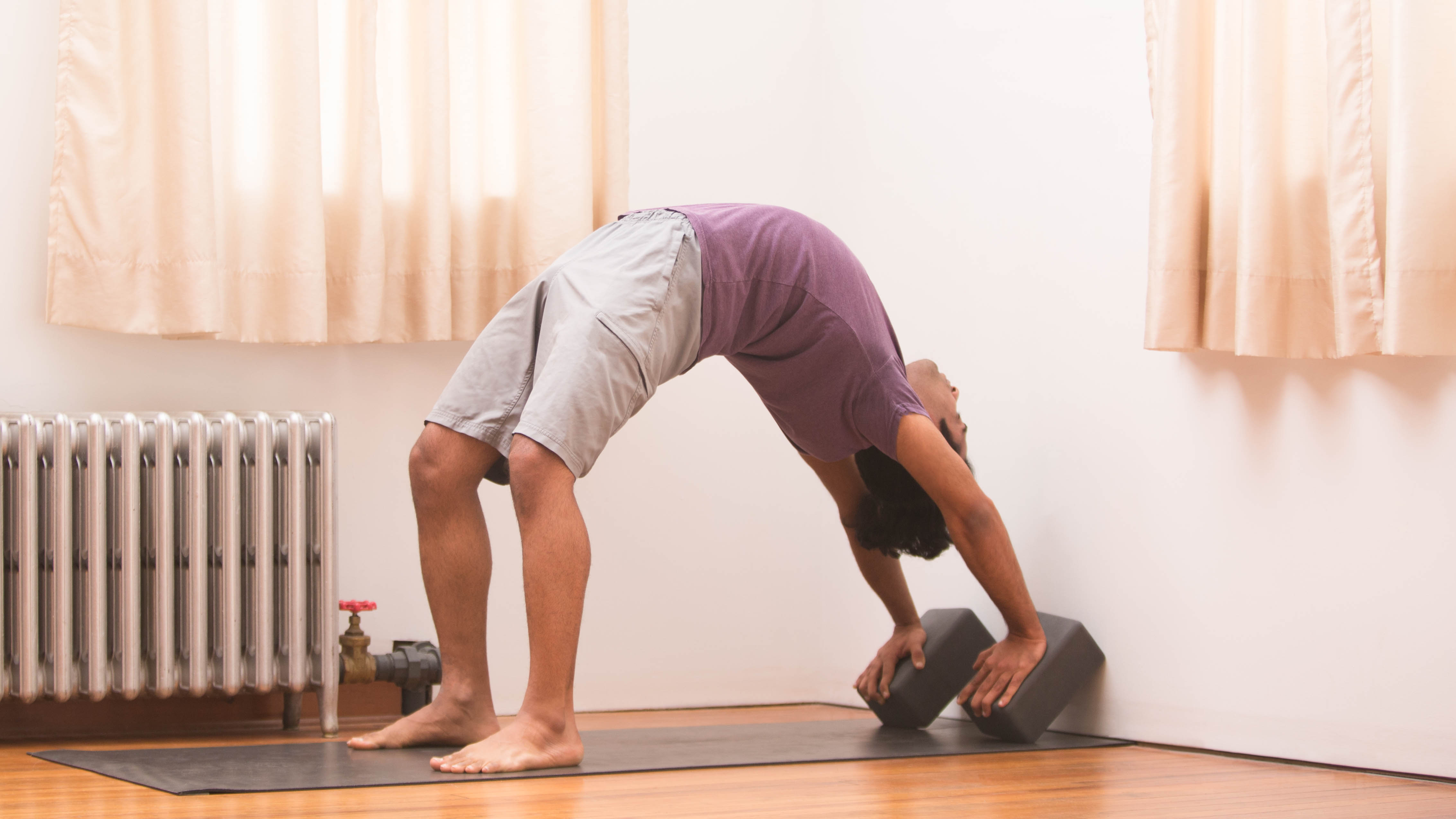 Use a Wall to Get More Out of Standing Backbend, Wheel, and Camel